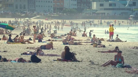 Crowded tropical beach scene - Bondi bea... | Stock Video | Pond5
