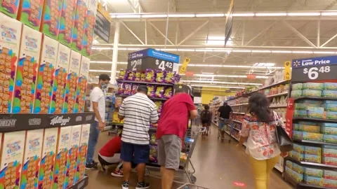 Crowds of people in Walmart wearing mask... | Stock Video | Pond5