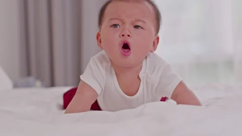 Crying and angry Newborn baby boy lying ... | Stock Video | Pond5