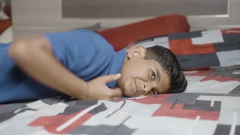 Crying angry kid falling on bed by wipin... | Stock Video | Pond5