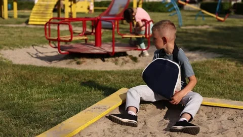 crying child with broken limb arm sits o... | Stock Video | Pond5