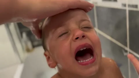 Crying child taking bath. Tearful little... | Stock Video | Pond5