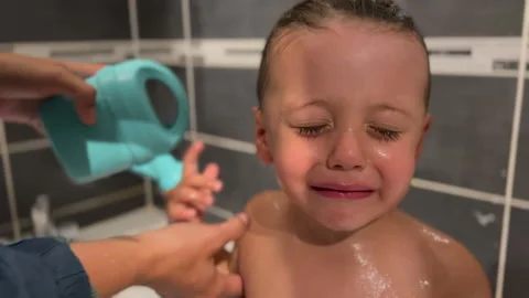Crying child taking bath. Tearful little... | Stock Video | Pond5