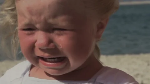 Crying little girl by the sea. Little gi... | Stock Video | Pond5