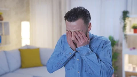 Crying man alone at home in frustration ... | Stock Video | Pond5