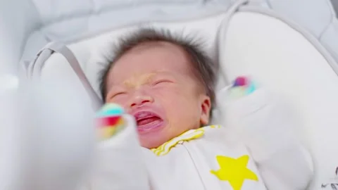 Crying Newborn baby boy lying on white b... | Stock Video | Pond5