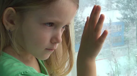 Crying Sad Child Looking Out Window, Sno... | Stock Video | Pond5