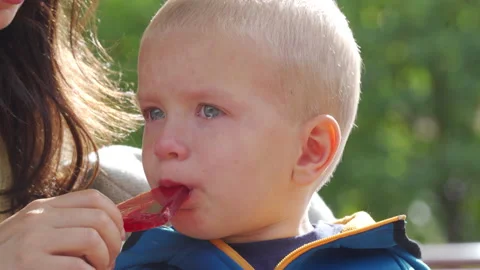 crying toddler child with watermelon sli... | Stock Video | Pond5