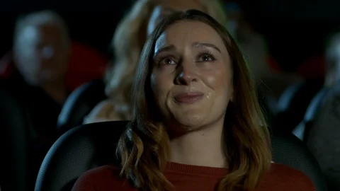 Crying young woman watching a sad film a... | Stock Video | Pond5