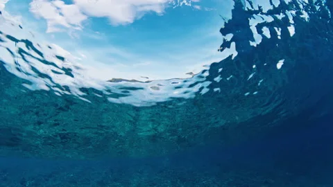 Crystal clear wave breaks on the shore i... | Stock Video | Pond5