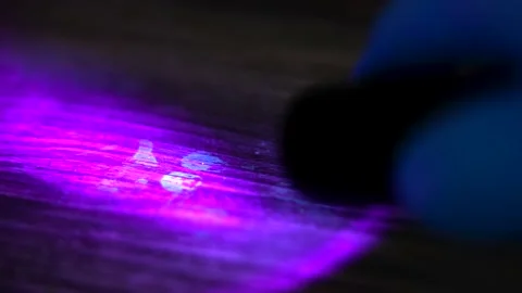 CSI Using UV Light To Detect Hidden Bloo... | Stock Video | Pond5