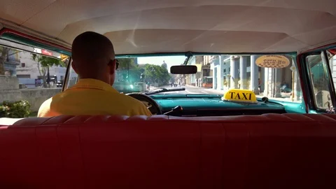 Cuban taxi driver in a classic 1950's am... | Stock Video | Pond5