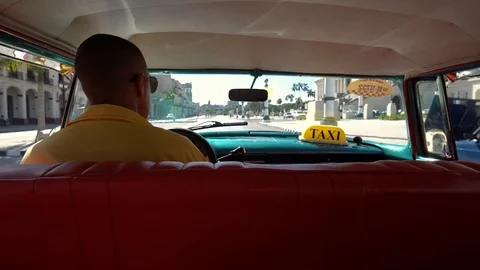 Cuban taxi driver driving 1950's america... | Stock Video | Pond5