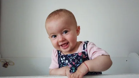 Cule baby laughing and having fun, stand... | Stock Video | Pond5
