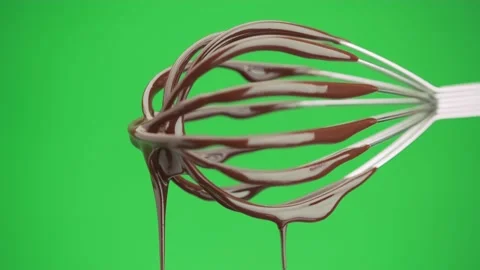 Culinary whisk in chocolate on a green s... | Stock Video | Pond5