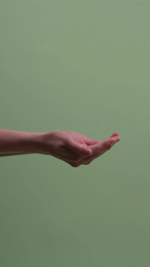 Cupped Hands Coming From Off Screen | Stock Video | Pond5