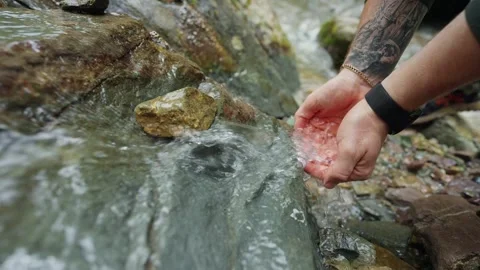 Cupping Mountain Stream Water in Hands | Stock Video | Pond5