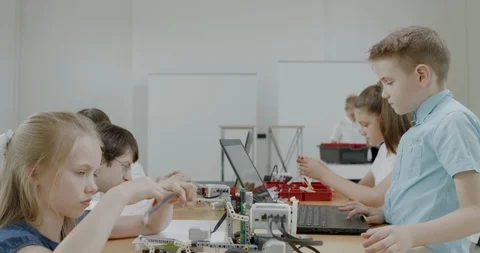 Curious kids working on a programable ro... | Stock Video | Pond5