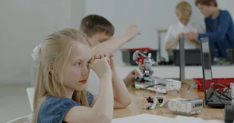 Curious kids working on a programable ro... | Stock Video | Pond5