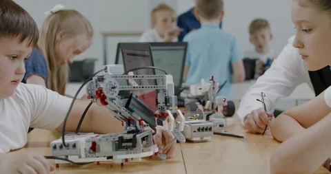 Curious kids working on a programable ro... | Stock Video | Pond5