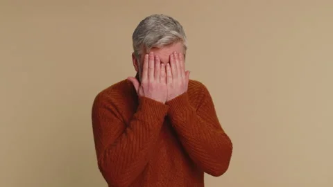 Curious middle-aged old man closing eyes... | Stock Video | Pond5