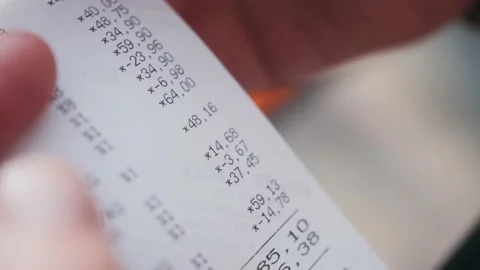 Customer checks Paper receipt on Superma... | Stock Video | Pond5