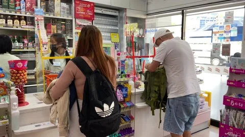 Customers paying for items at 7 eleven c... | Stock Video | Pond5