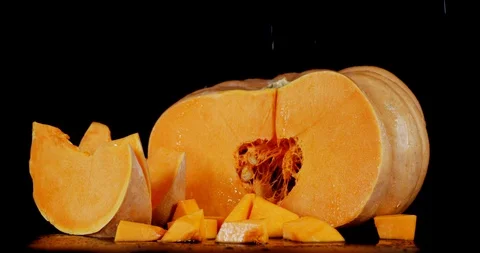 To cut fresh pumpkin falling water drops... | Stock Video | Pond5