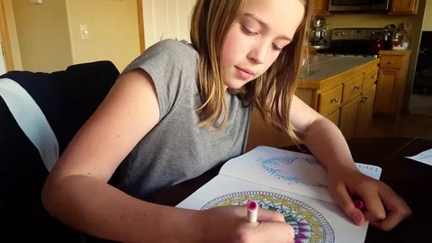 Cute 11 year old brunette girl intent on... | Stock Video | Pond5