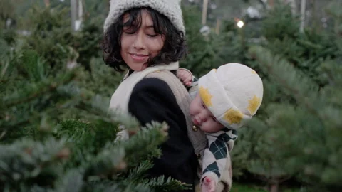 Cute Asian baby reaches to touch tree pl... | Stock Video | Pond5