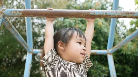 Cute Asian little girl hanging the monke... | Stock Video | Pond5