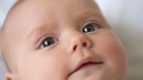Cute baby face close up, infant looking ... | Stock Video | Pond5