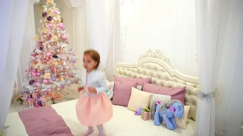 Cute Baby Girl Having Fun And Jumping on... | Stock Video | Pond5