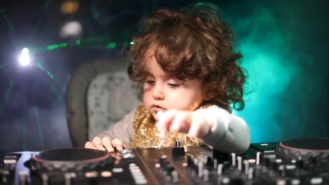 Cute baby girl mixing on dj`s deck at ni... | Stock Video | Pond5