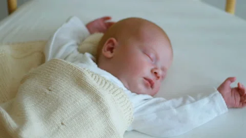 Cute baby girl sleeping on the bed at ho... | Stock Video | Pond5