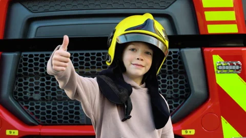 Cute boy, child dressed in fire fighters... | Stock Video | Pond5