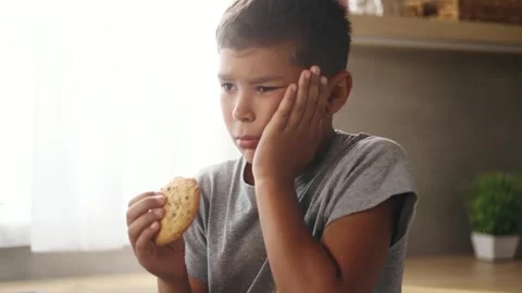 Cute boy child eating cookie and having ... | Stock Video | Pond5