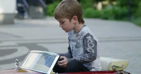 Cute Boy Drives Electric Red Car. Kid Ch... | Stock Video | Pond5