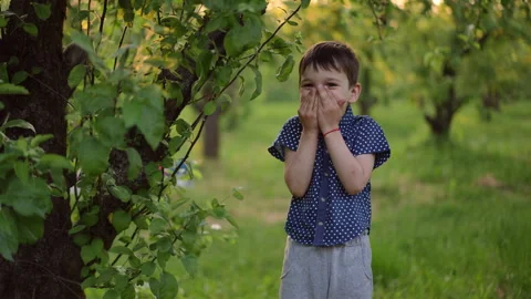 Cute boy looking around and looking at c... | Stock Video | Pond5