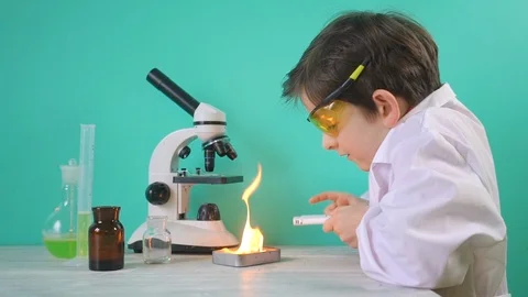 Cute boy is making science experiments w... | Stock Video | Pond5