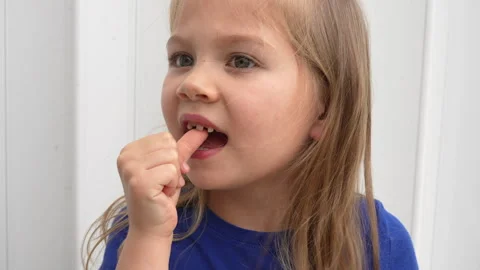 Cute Caucasian preschool girl wiggling h... | Stock Video | Pond5