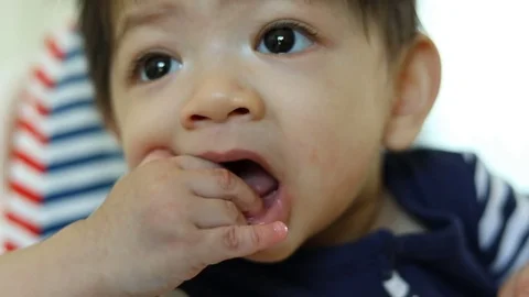 cute child baby using finger hand in mou... | Stock Video | Pond5