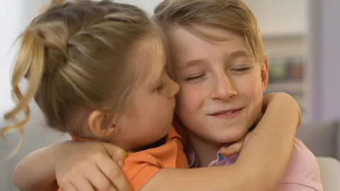 Cute children embracing, girl kissing bo... | Stock Video | Pond5