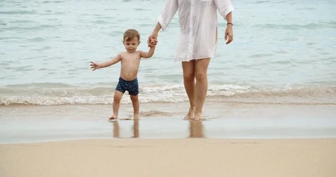 Cute expressive baby making careful step... | Stock Video | Pond5