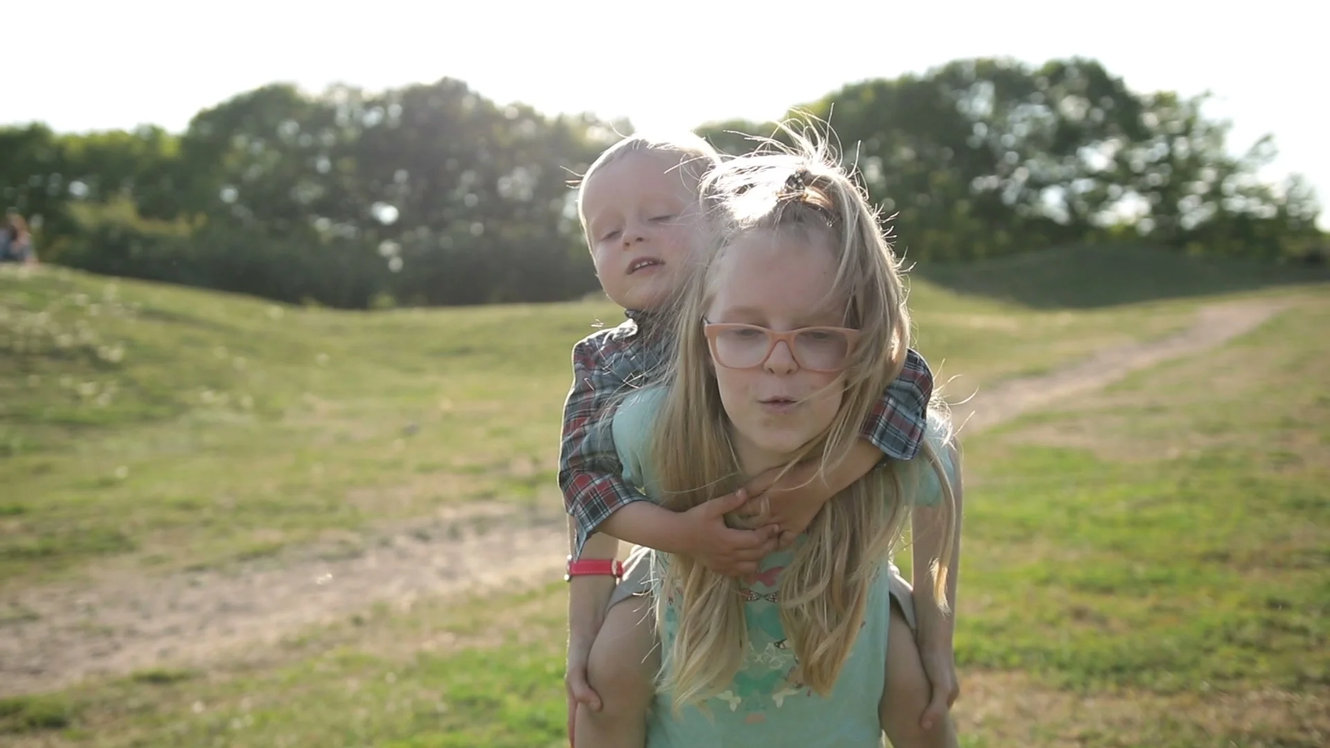 Boy And Girl Piggyback Ride