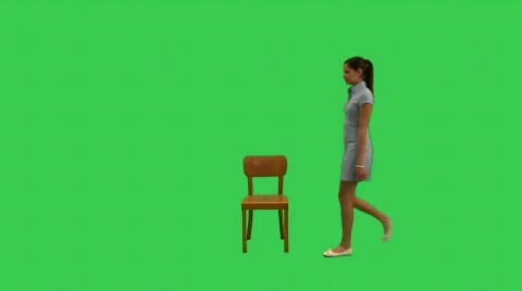cute girl sitting down - green screen - ... | Stock Video | Pond5