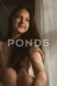 A cute girl is sitting by the window. The girl at the window ~ Hi Res ...