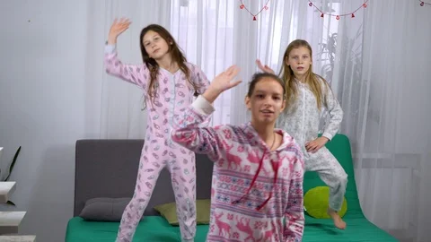 cute girls in pajamas dancing at home | Stock Video | Pond5