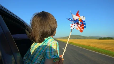 Cute happy boy child leaned out, looking... | Stock Video | Pond5