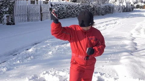 Cute happy kid dancing in the snow slow ... | Stock Video | Pond5